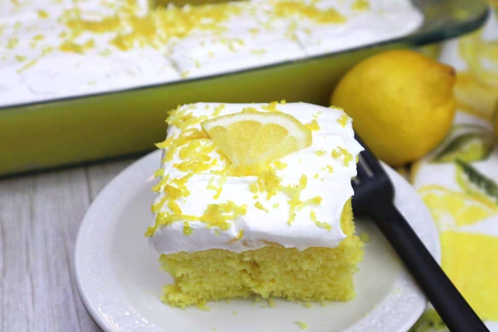 Easy Lemon Poke Cake with Pudding Recipe - The Freckled Cook